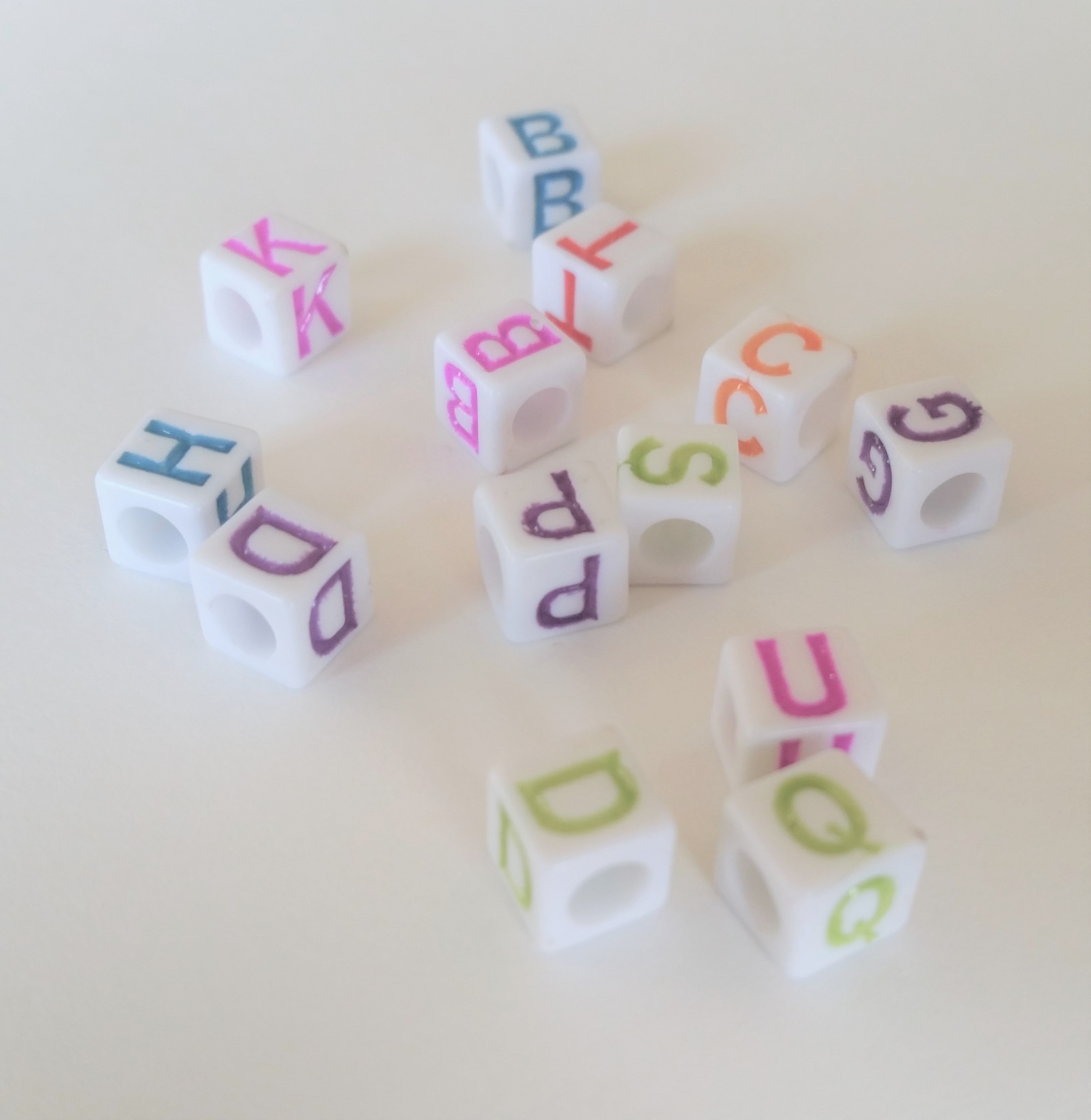 Teach spelling using just some dot paint and beads!